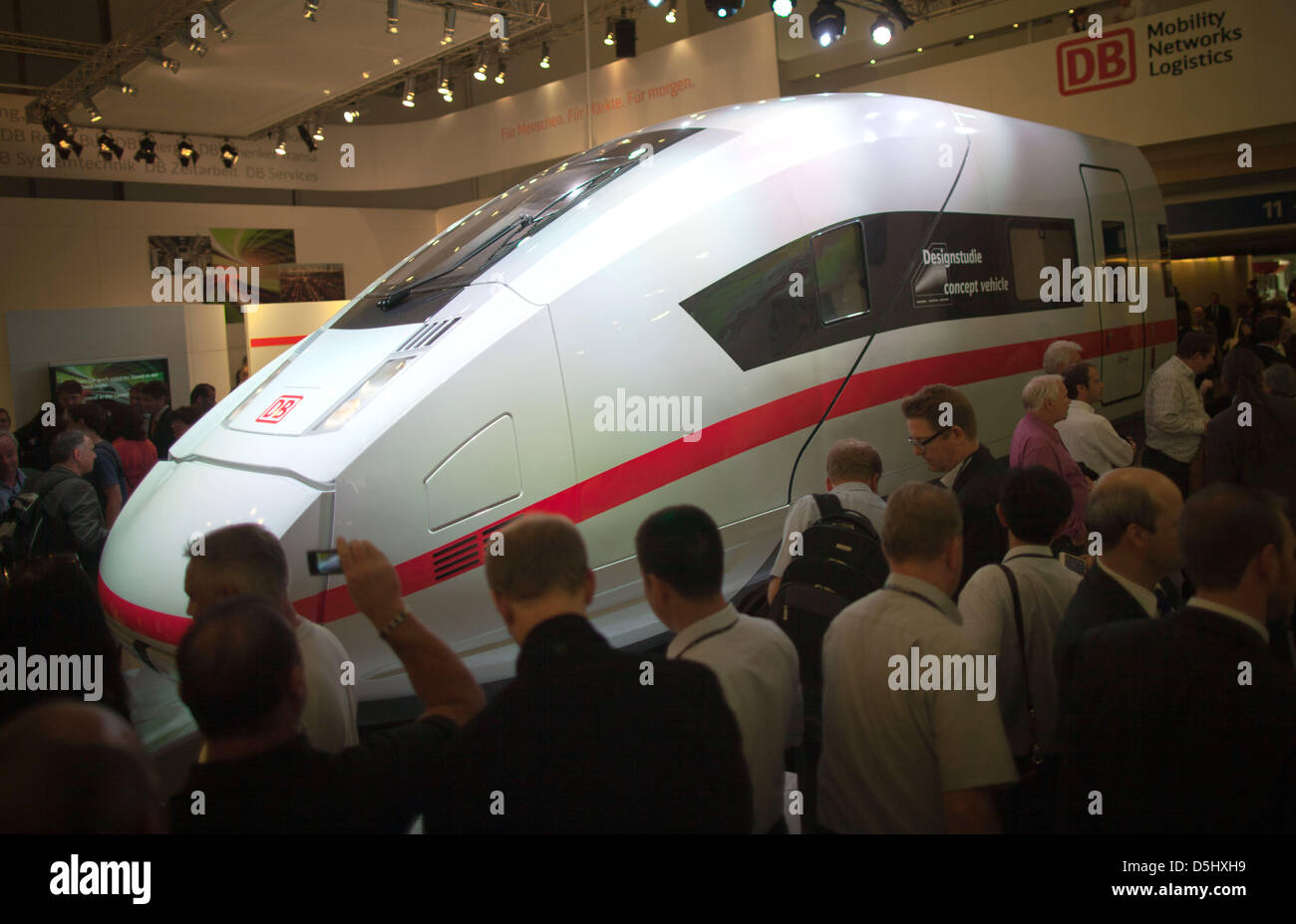 Visitors look at a design of a new long distance traing for the Deutsch ...