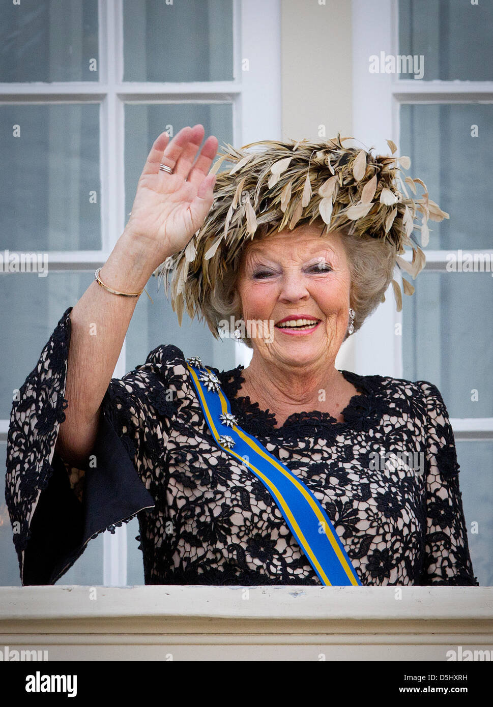 Dutch Queen Beatrix waves from the balcony of palace Noordeinde in The ...