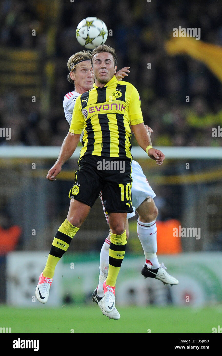 Dortmund's Mario Goetze (front) and Amsterdam's Christian Poulsen vie ...