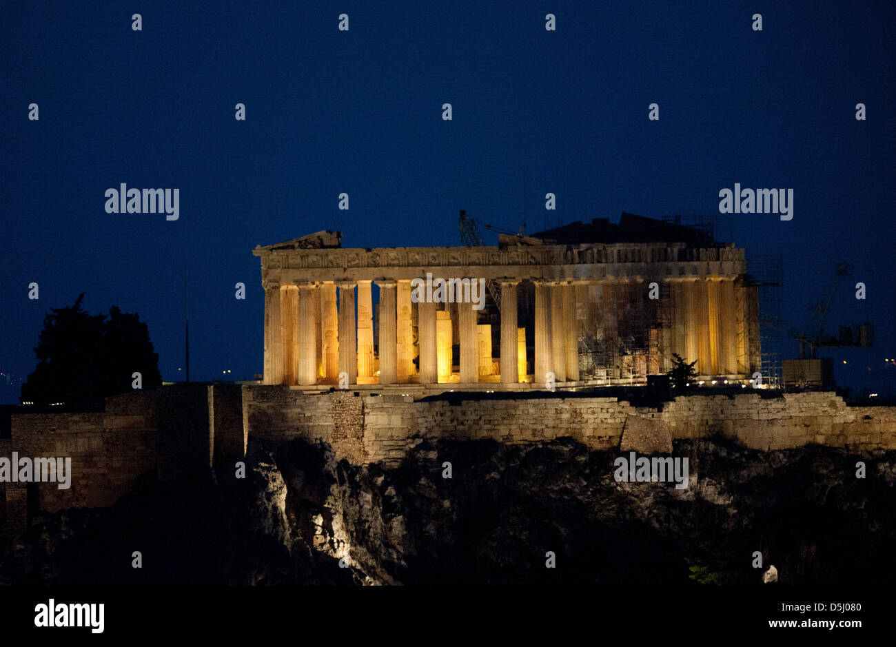 The Parthenon is illuminated atop the Acropolis in Athens, Greece, 19 ...