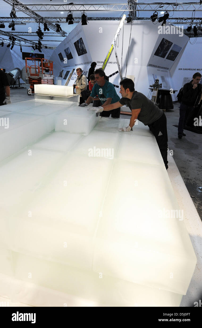 People install a model iceberg to portray the topic of climate change ...