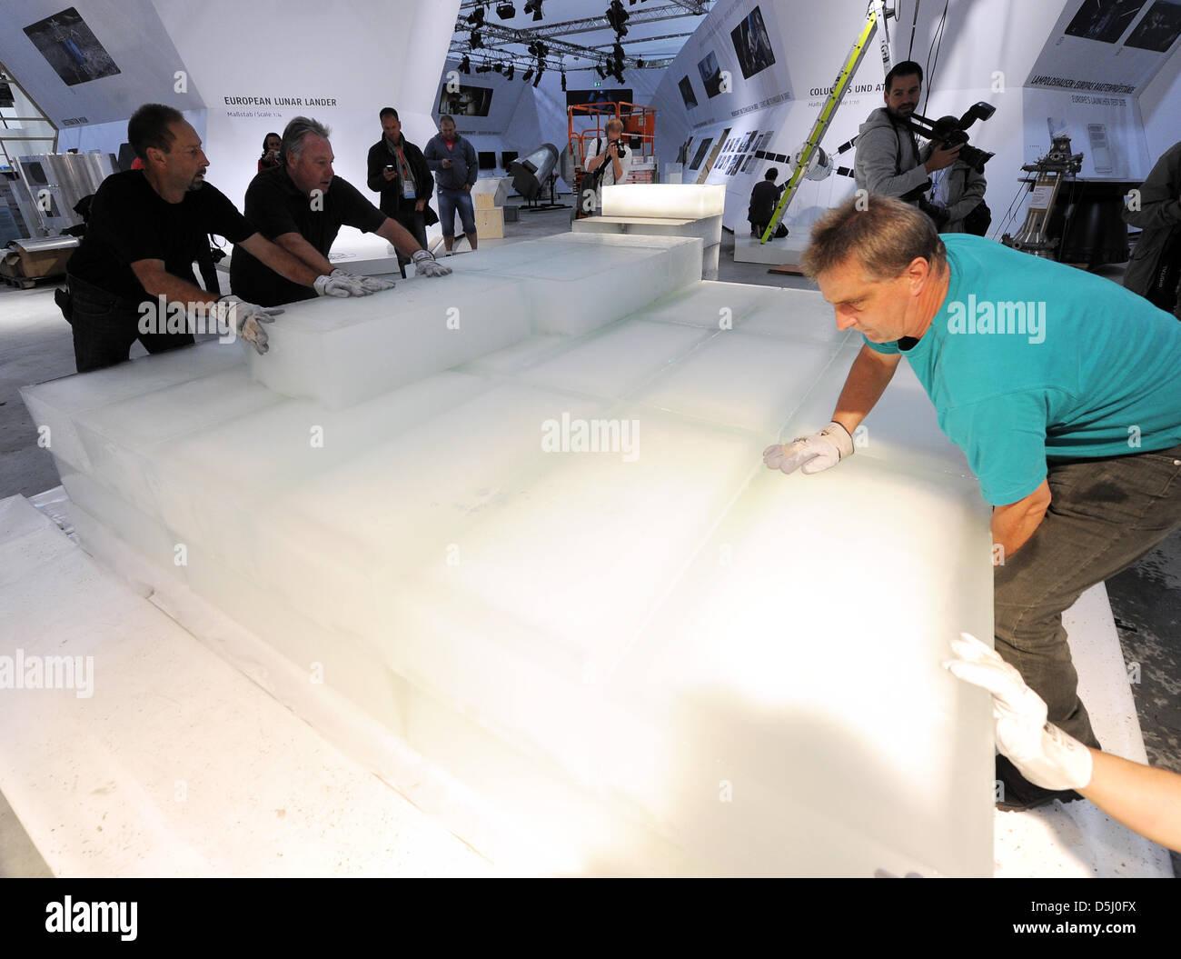 People install a model iceberg to portray the topic of climate change ...