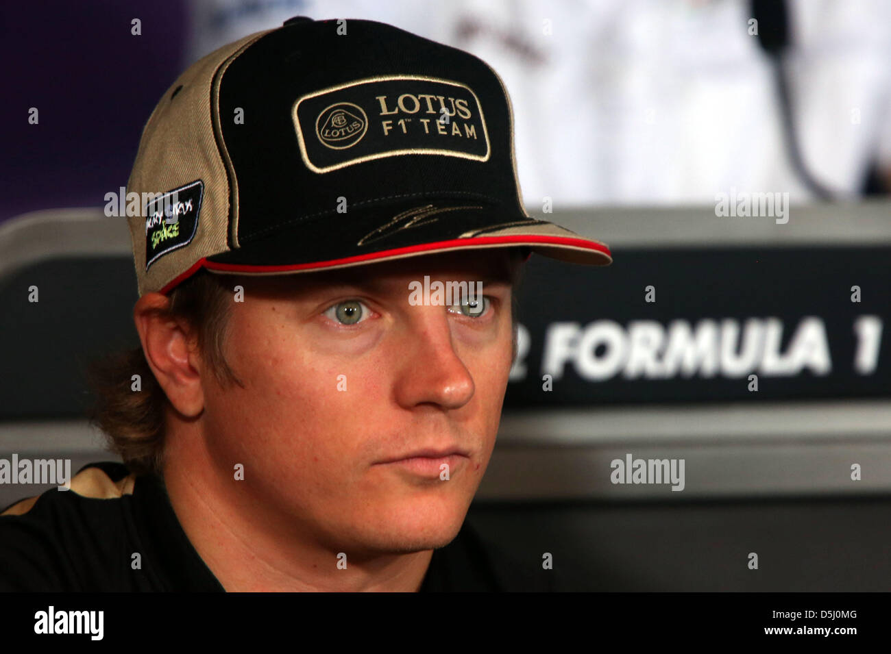 Finnish Formula One driver Kimi Raikkonen of Lotus listens to questions ...