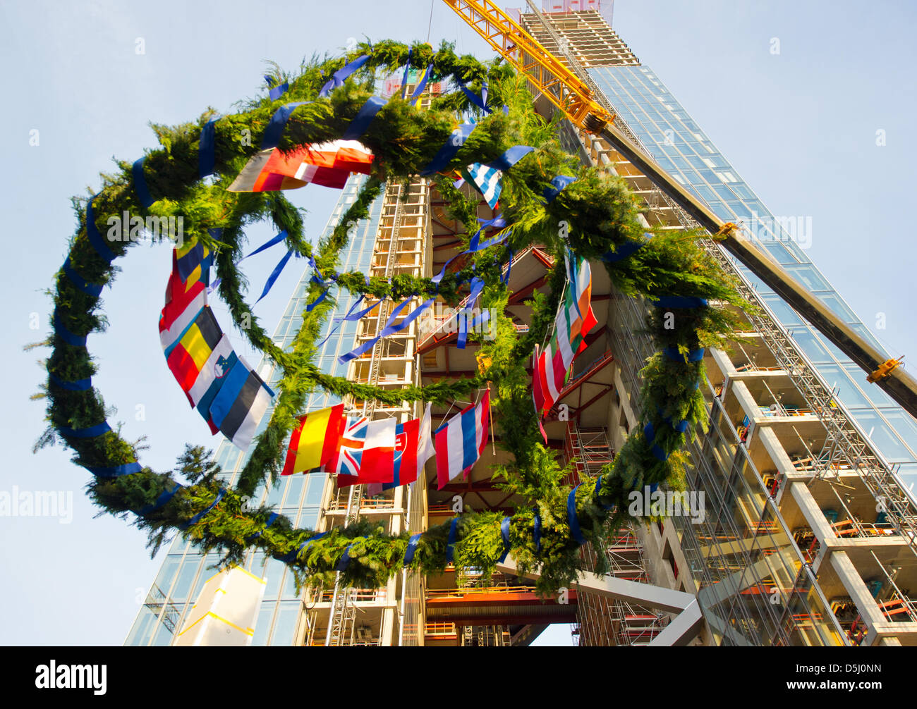 Flags of the Eu member states decorate the topping-out wreath for the ...