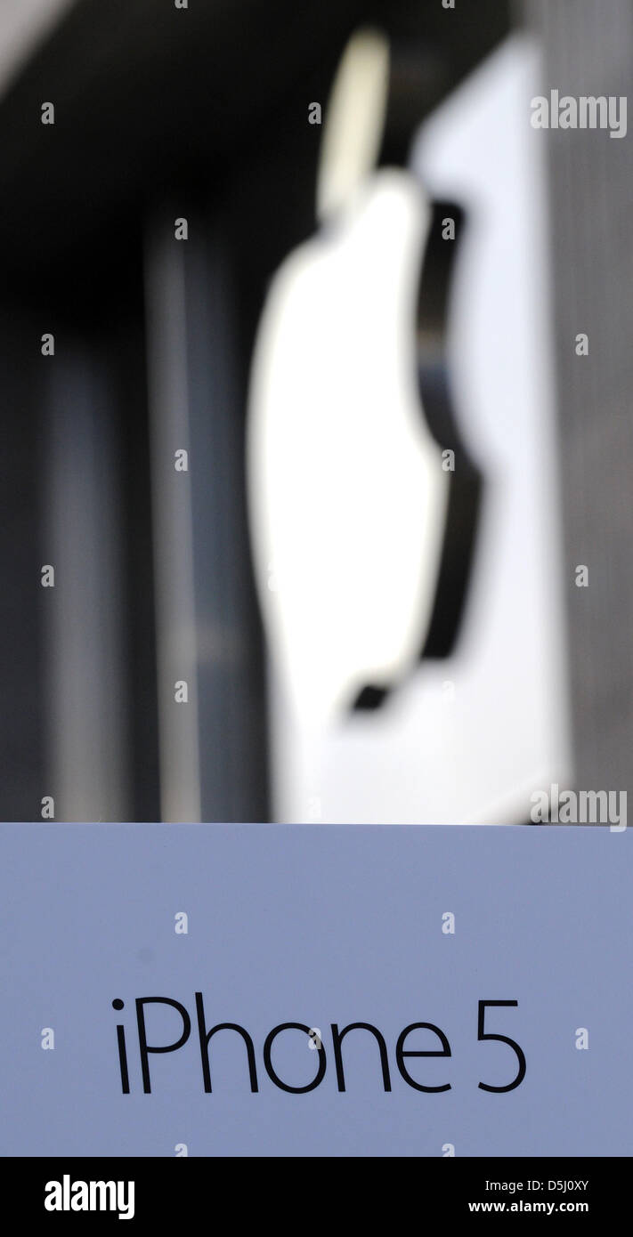 A sign with the lettering iPhone 5 is visible in front of an Apple ...