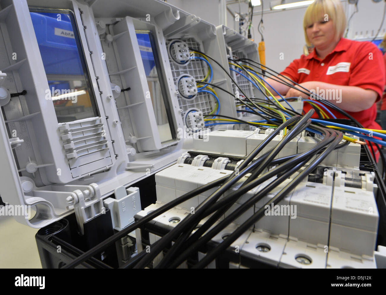 Heike Boettcher works on industrial plug and socket devices at the ...