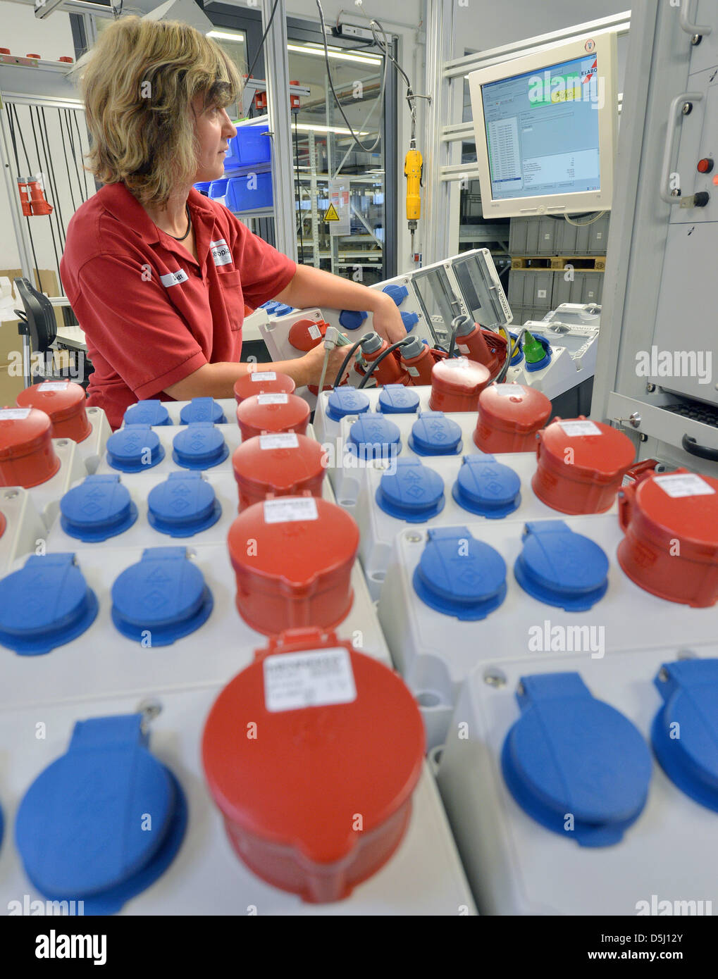 Silke Gebhardt works on industrial plug and socket devices at the ...