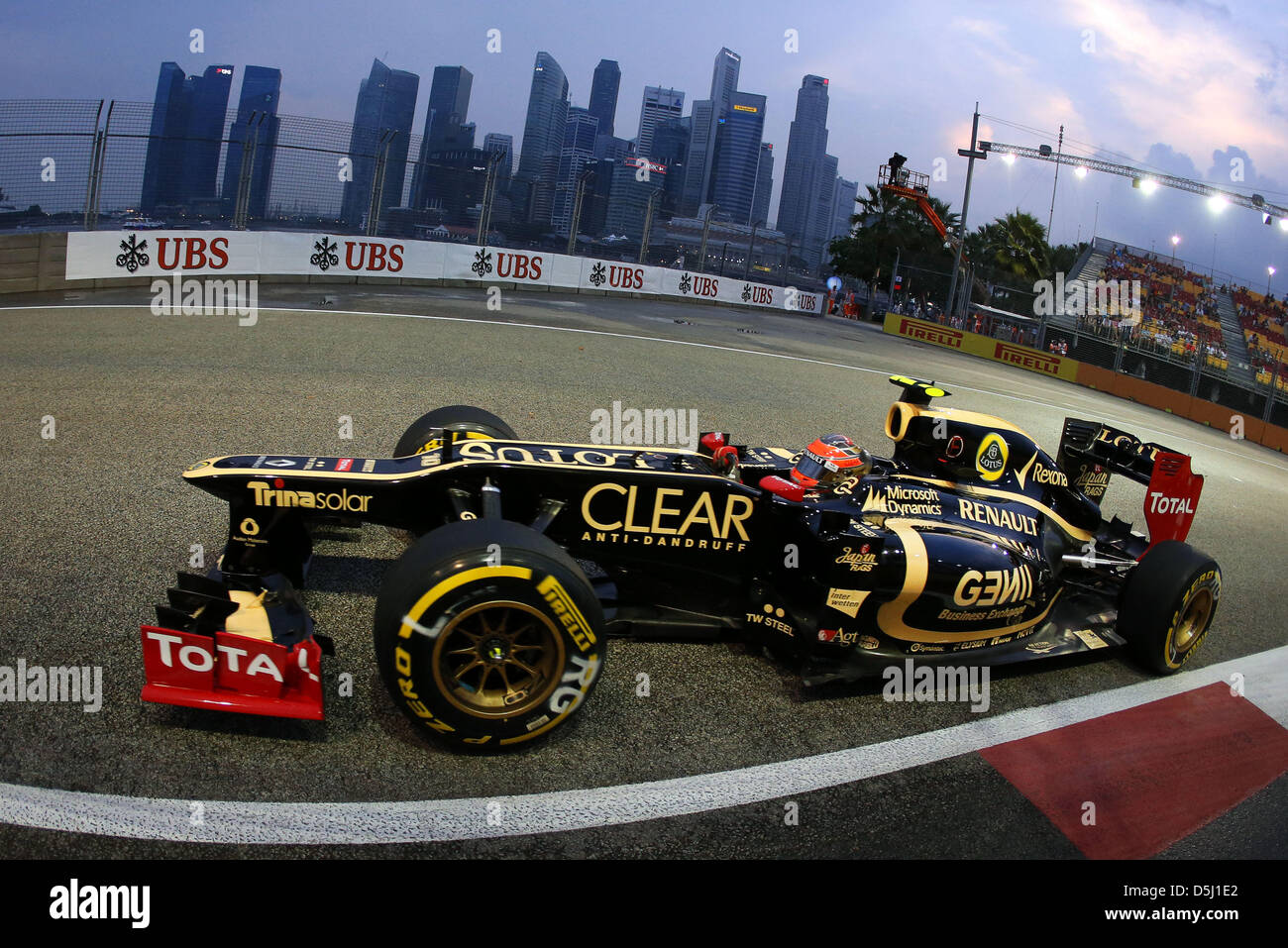 French Formula One driver Romain Grosjean of Lotus steers his car ...