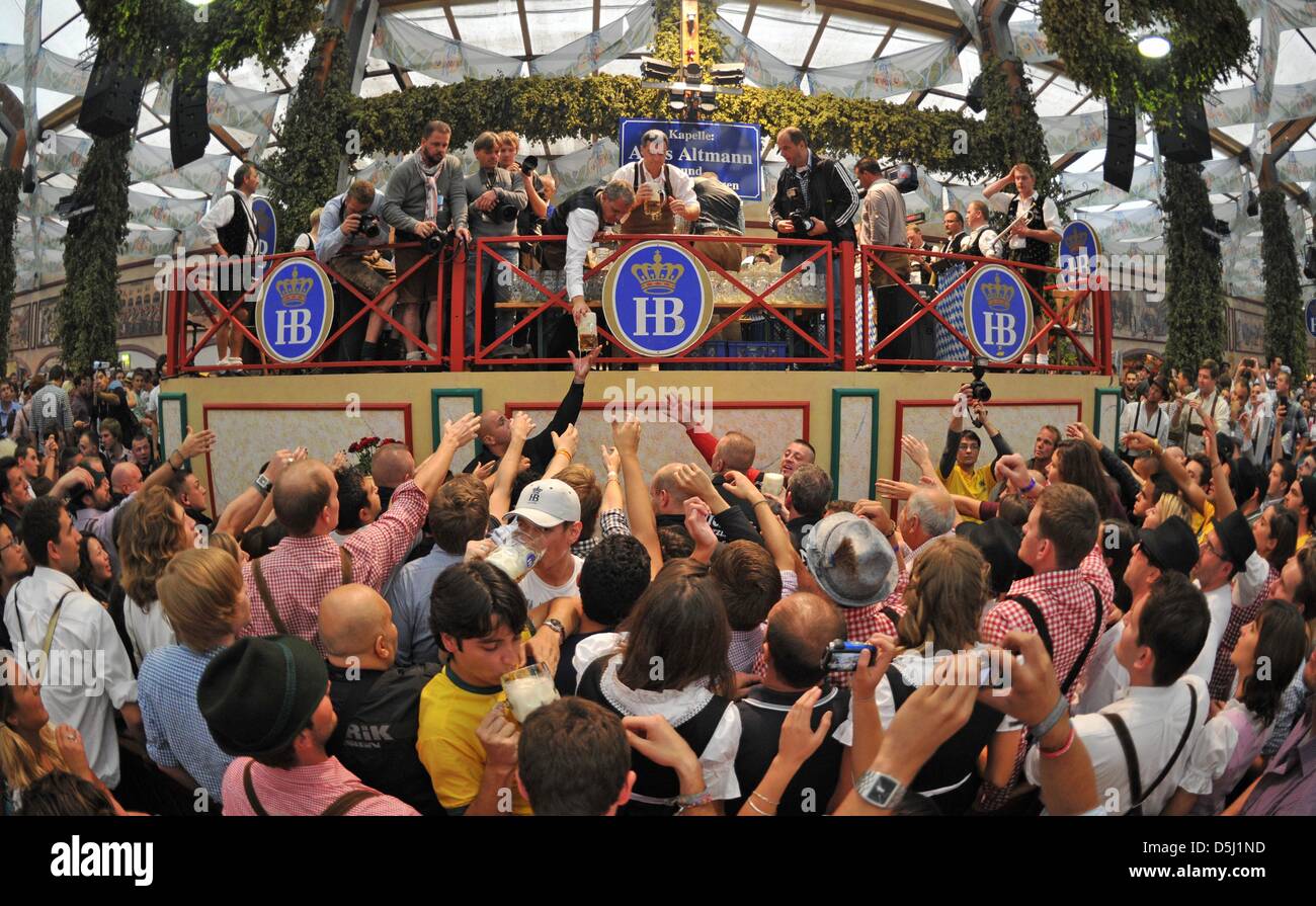 People visit the Hofbraeu tent during the opening of Oktoberfest in ...
