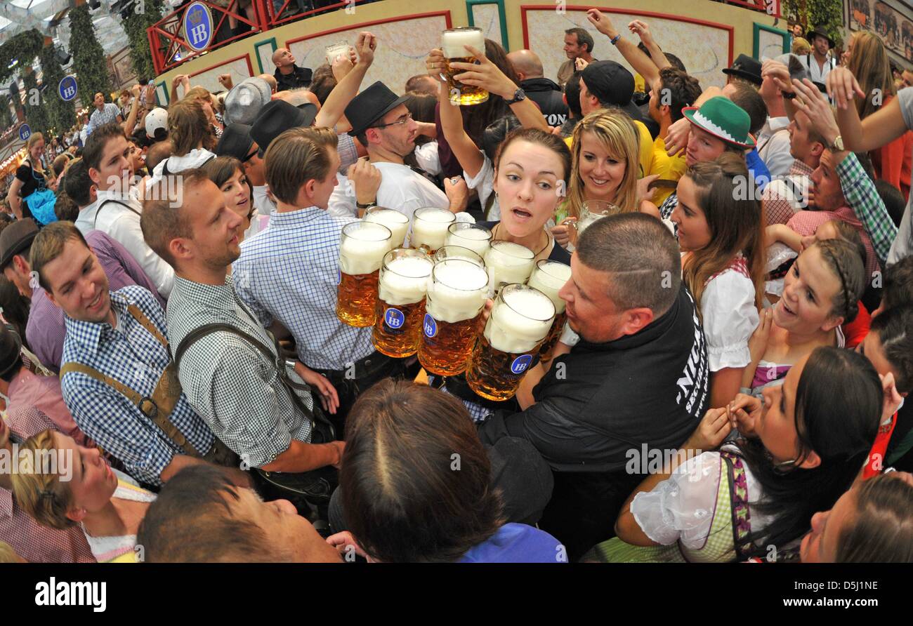 People visit the Hofbraeu tent during the opening of Oktoberfest in ...