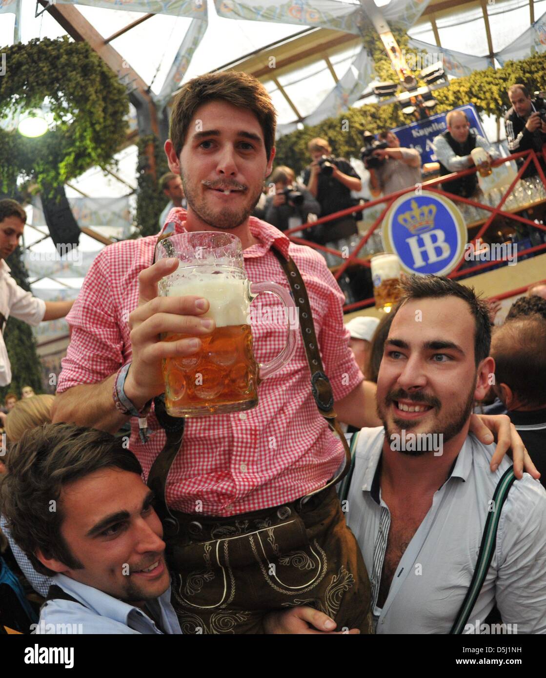 People visit the Hofbraeu tent during the opening of Oktoberfest in ...