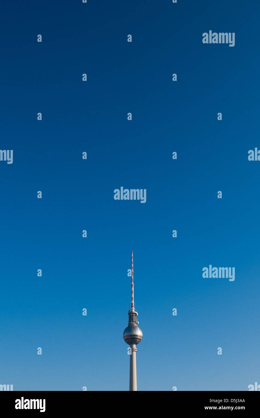 The television tower is seen in front of the blue sky in Berlin ...