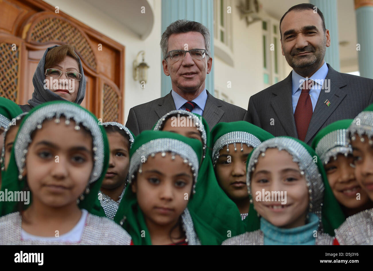 German Defence Minister Thomas de Maiziere (C) and the Governor of ...