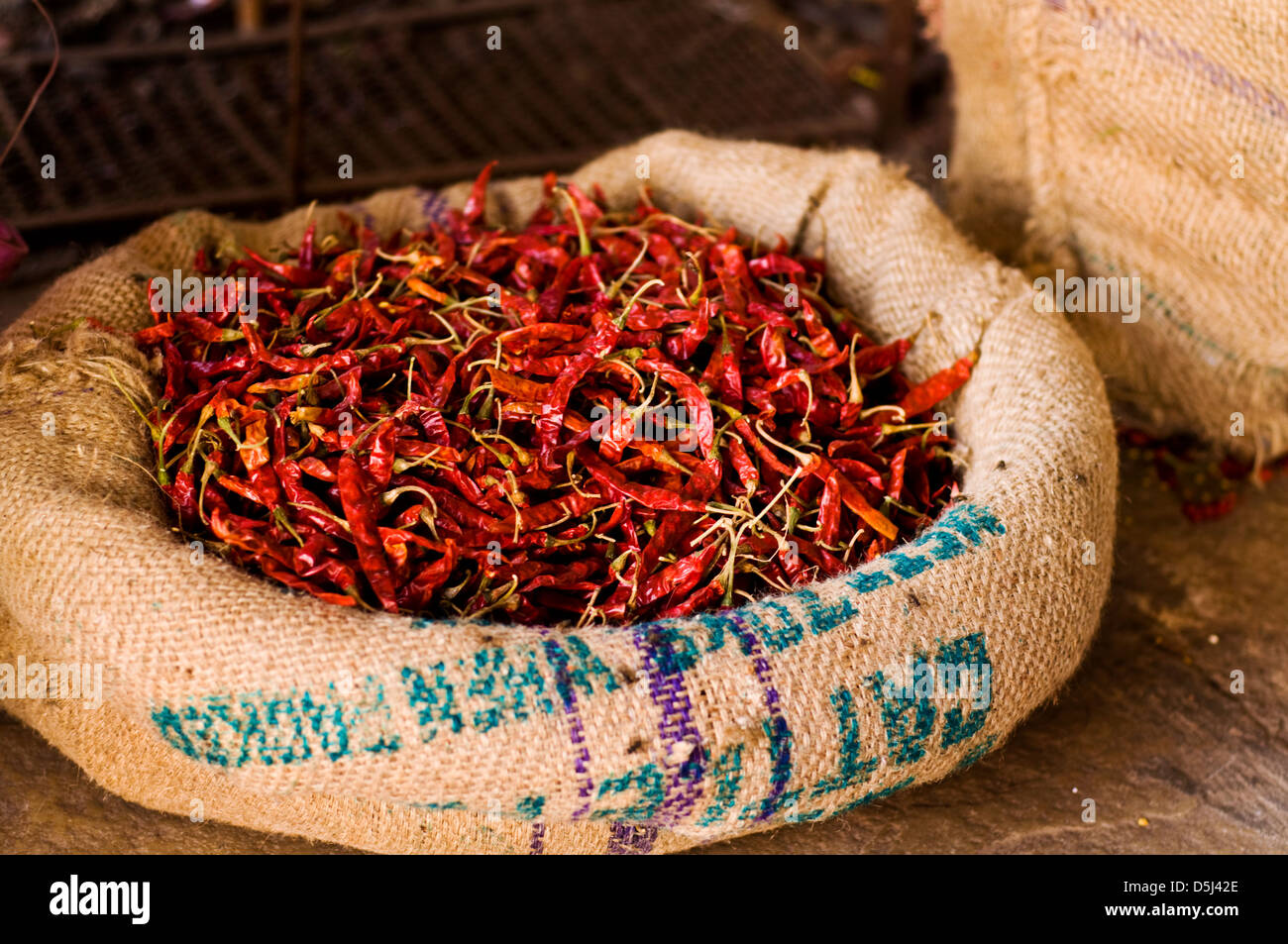 Hessian sack of dried red chilli peppers Stock Photo - Alamy