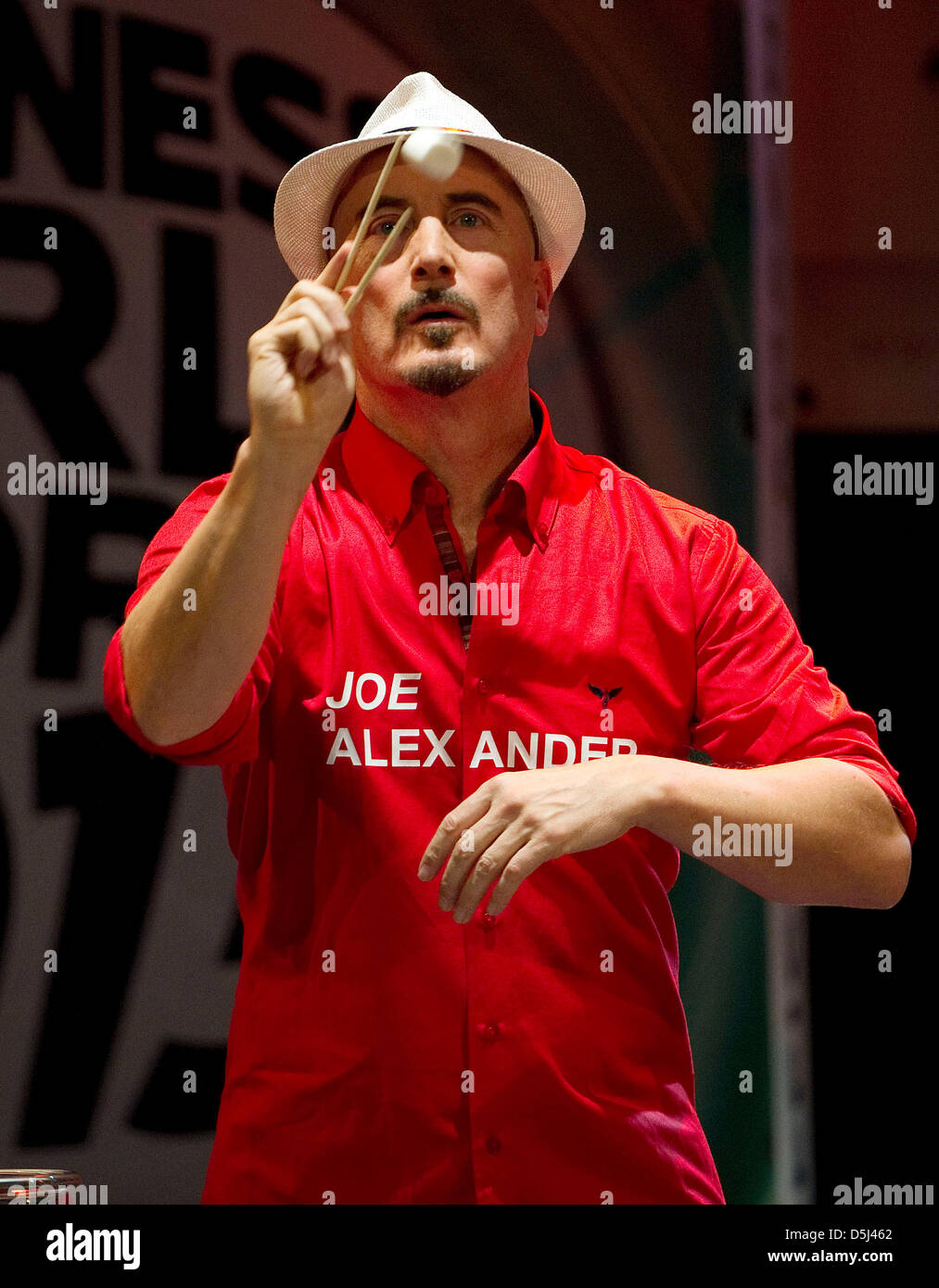 Entertainer Joe Alexander catches a marshmallow with a pair of ...