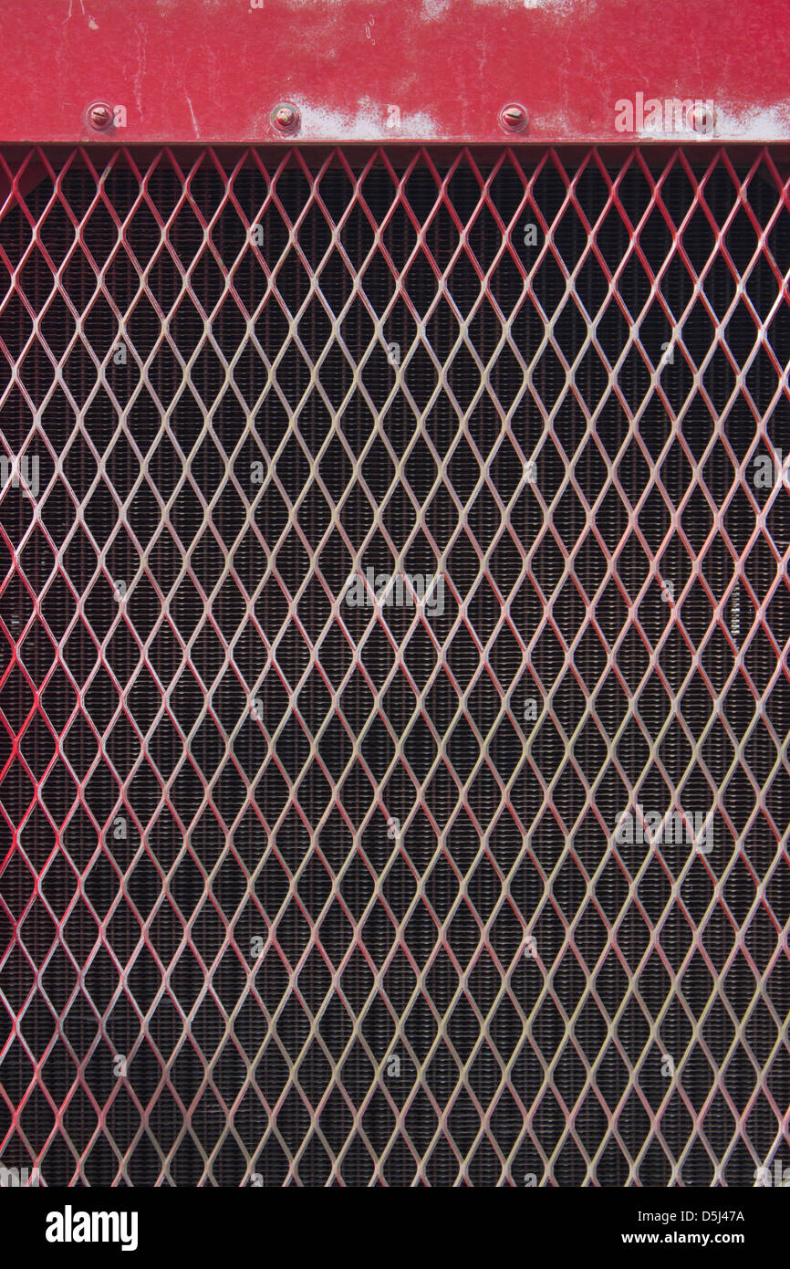 a distressed red metal grate pattern Stock Photo - Alamy