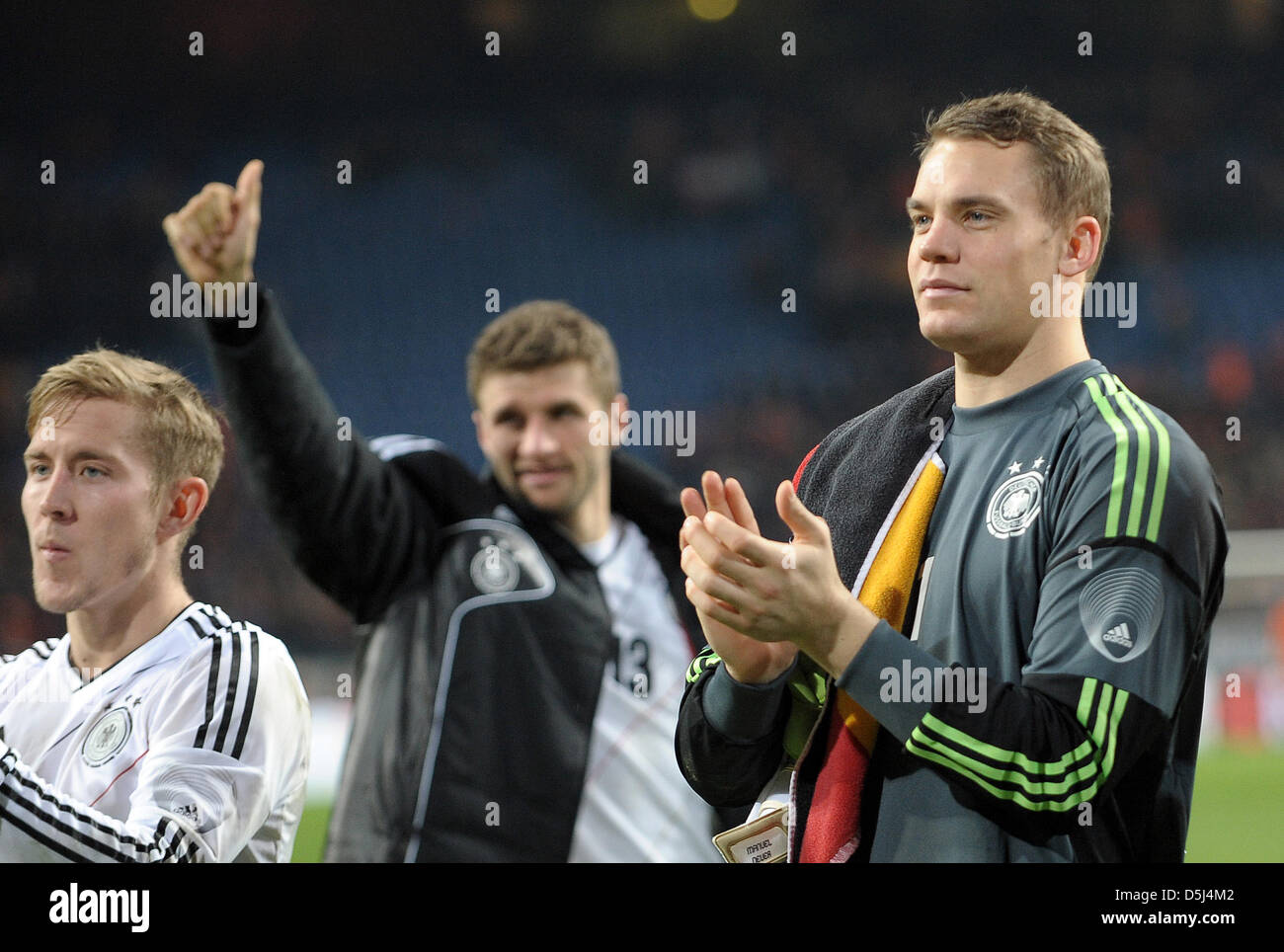Germany's Lewis Holtby (L-R), Thomas Mueller and Manuel Neuer after the ...