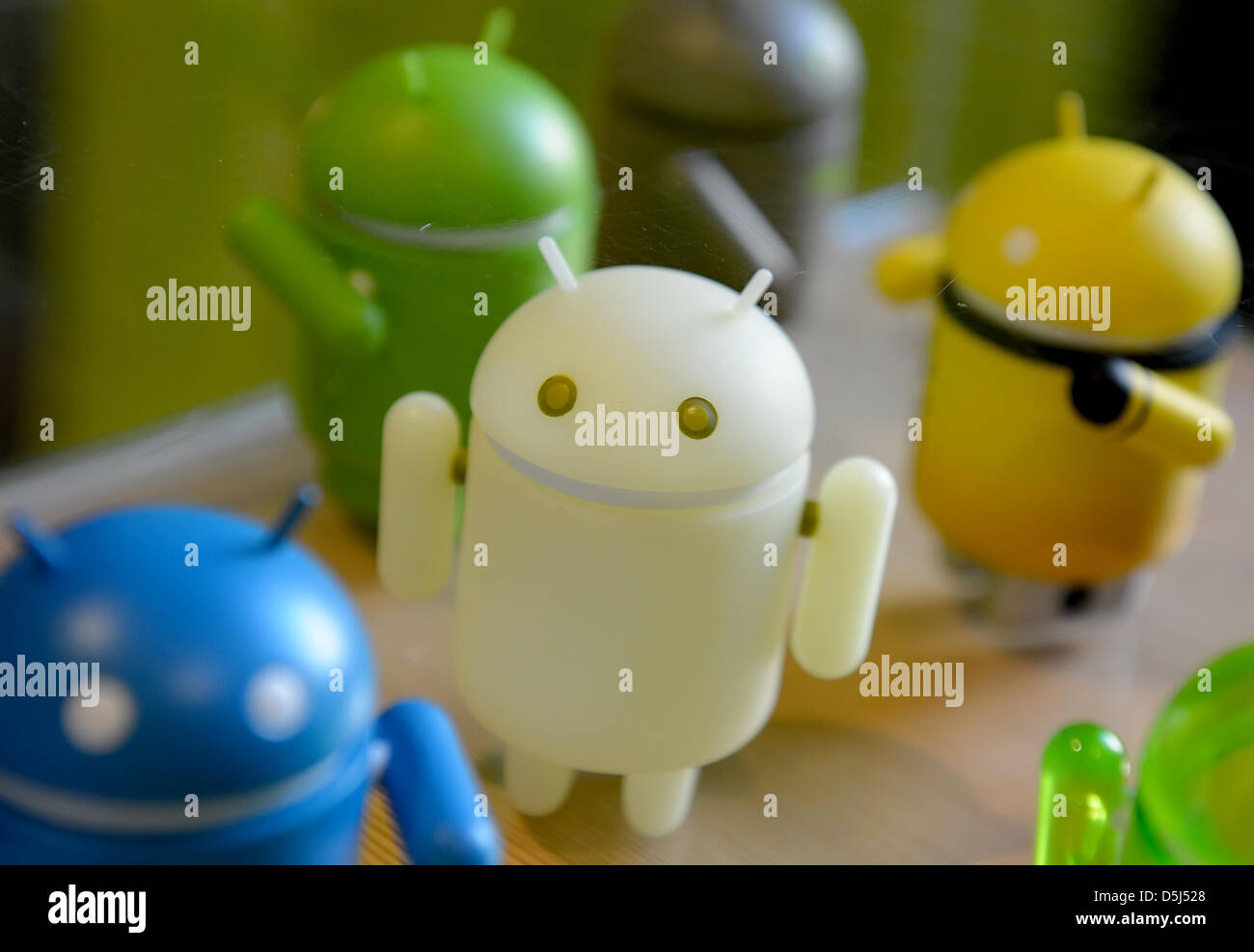 Colorful mini Android toys are pictured in a glass cabinet at the ...