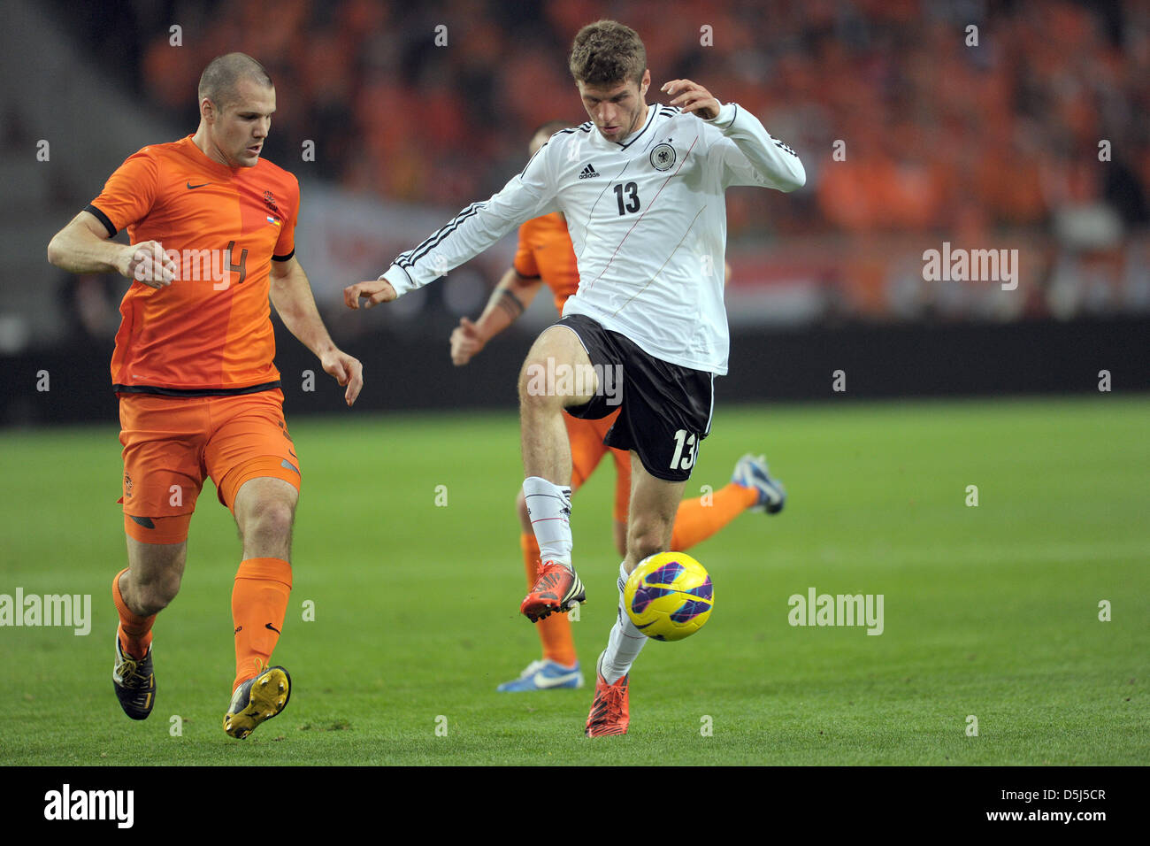 Germany's Thomas Mueller (R) and Netherlands' Ron Vlaar during the ...