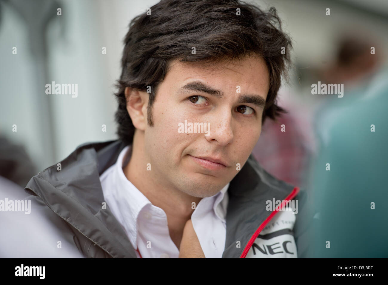 Mexican Formula One driver Sergio Perez of Sauber has a chat in the ...