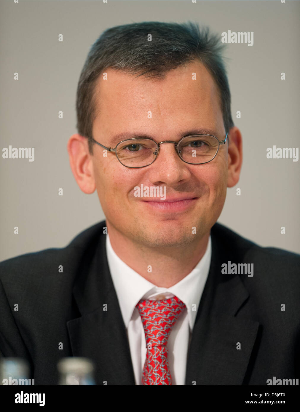CFO of Infineon Dominik Asam sits during a press conference on Infineon ...