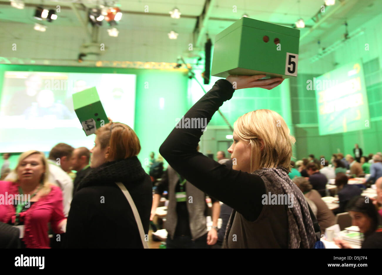Election workers carry ballot boxes at the 34th federal delegate ...