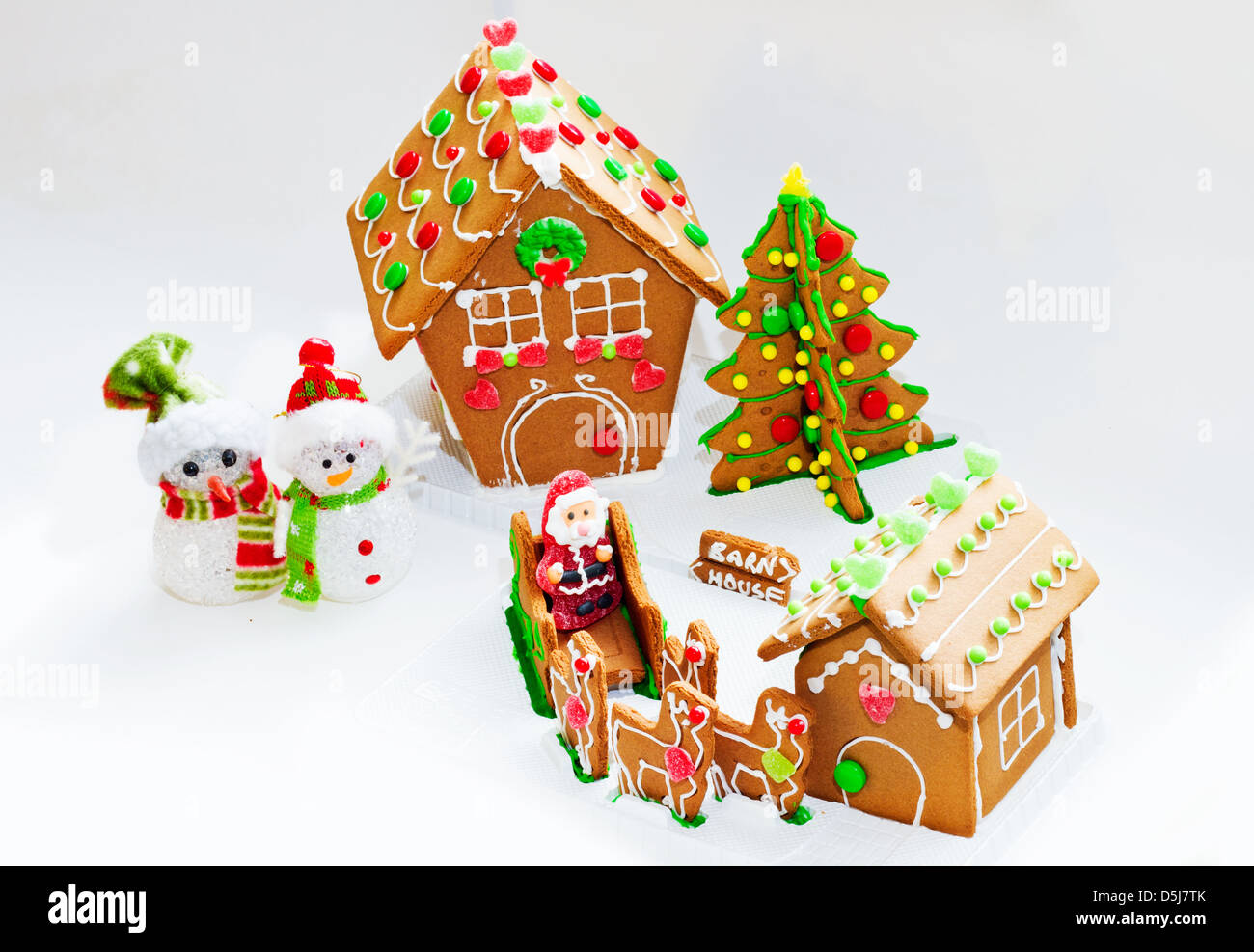 Gingerbread house, Christmas tree, snowman and Santa covered with ...