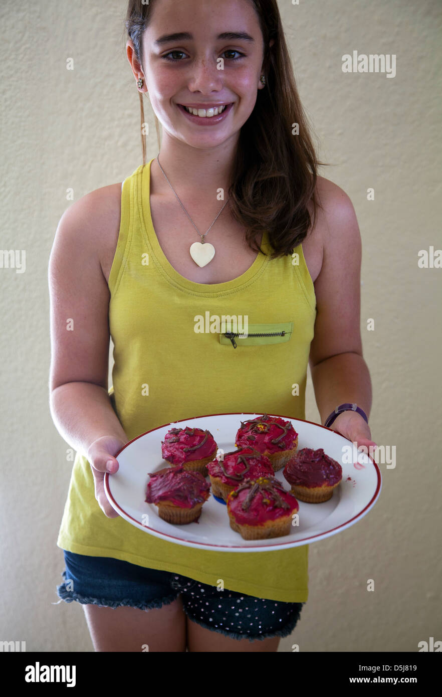 Girl With Plate of Cupcakes She Baked Stock Photo - Alamy