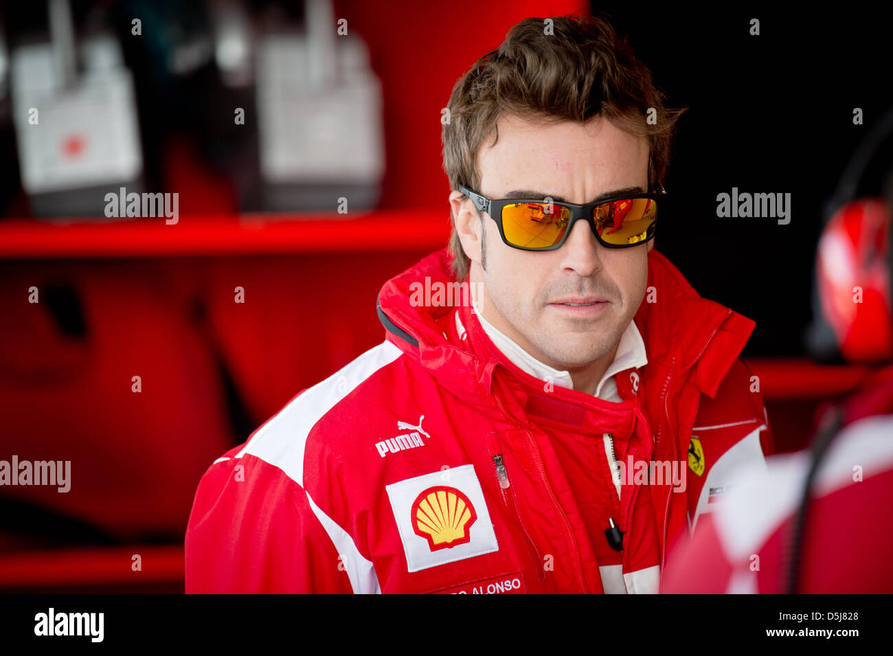 Spanish Formula One driver Fernando Alonso of Ferrari stands in the pit ...
