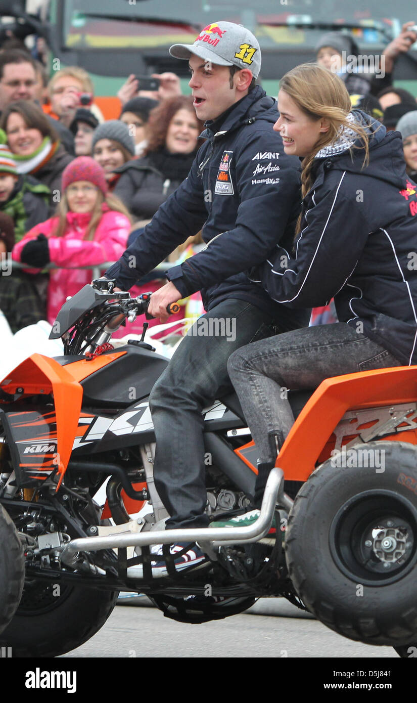 Moto3 world champion Sandro Cortese and his girlfriend Anna ride on a ...