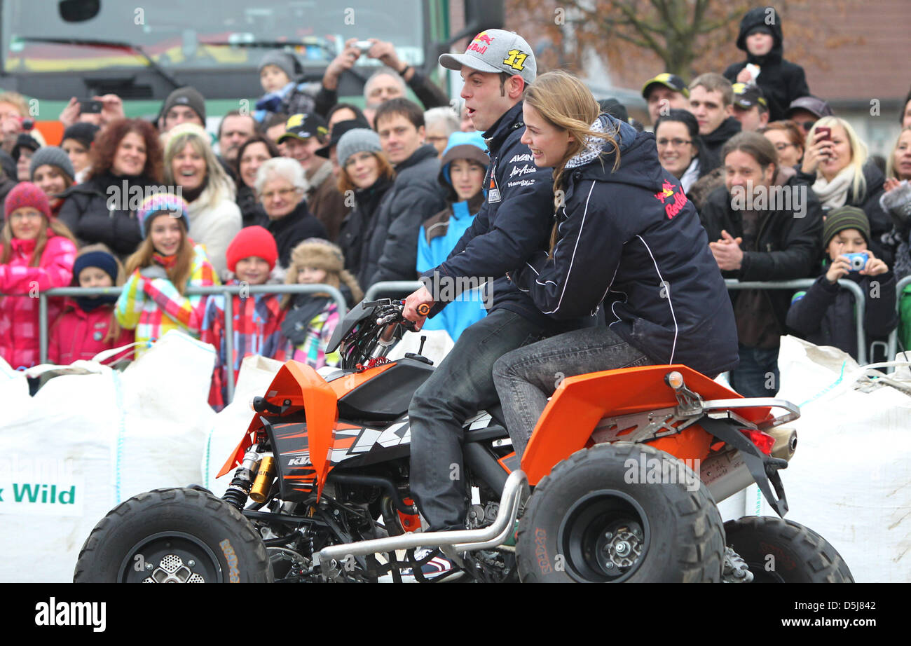 Moto3 world champion Sandro Cortese and his girlfriend Anna ride on a ...