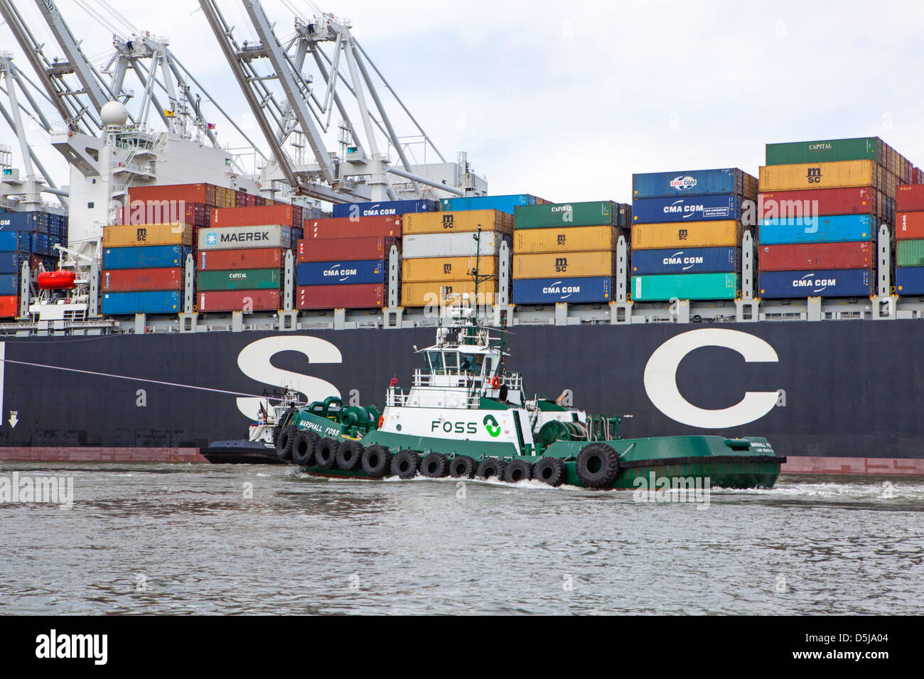 crane and container ship with tug boat Oakland, California Stock Photo ...