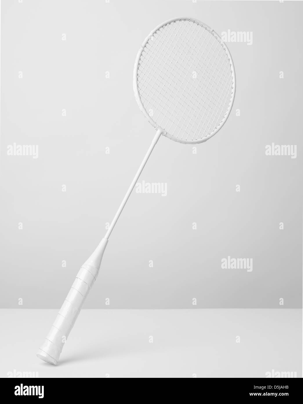 A Badminton racket sits on a white table Stock Photo - Alamy