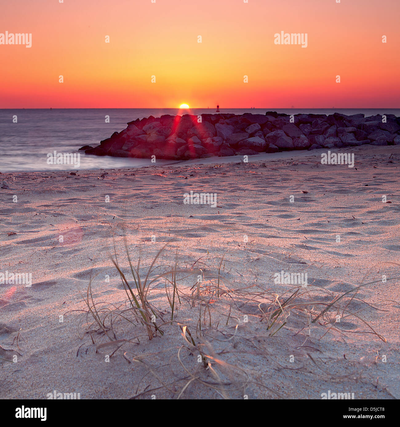 Sunrise over the Bay, the sun just peaking over the horizon, with a ...