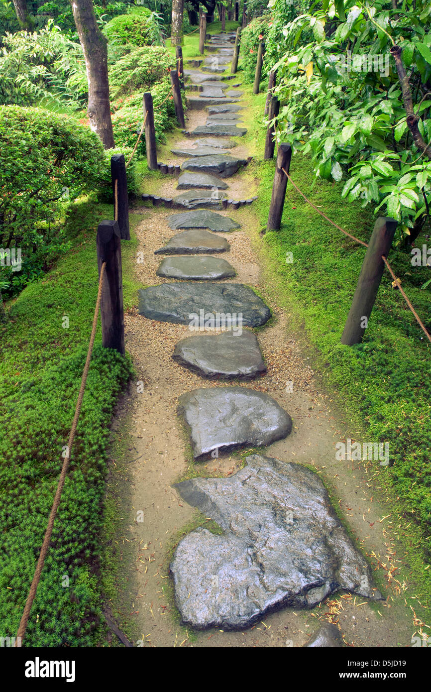wet stone pathway in Japanese Zen garden by summer Stock Photo - Alamy