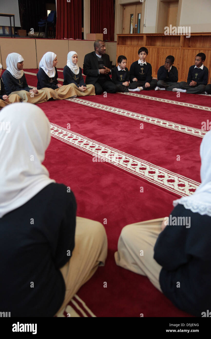 Children gather for a discussion at a Muslim school in England Stock ...
