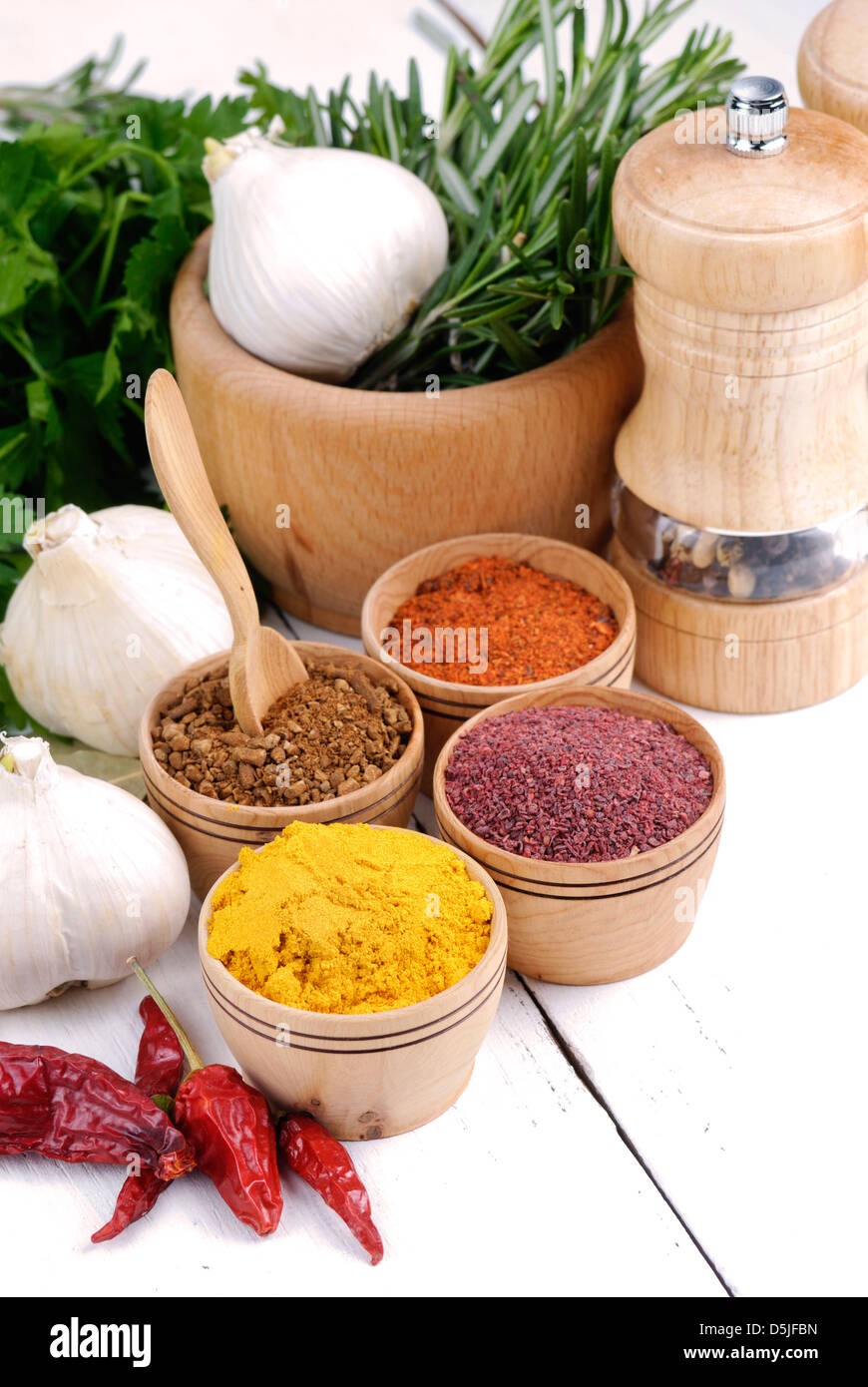 Different kinds of seasonings and herbs on the white oak table Stock ...