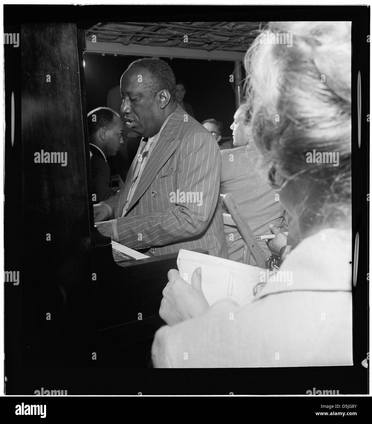 A portrait of James Price Johnson taken in July 1947 near a riverboat ...