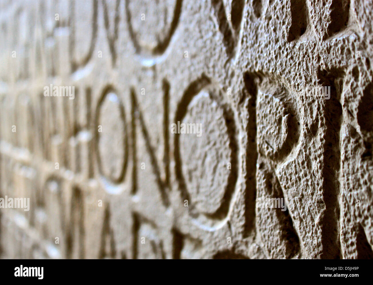 Latin text carved into stone Stock Photo - Alamy