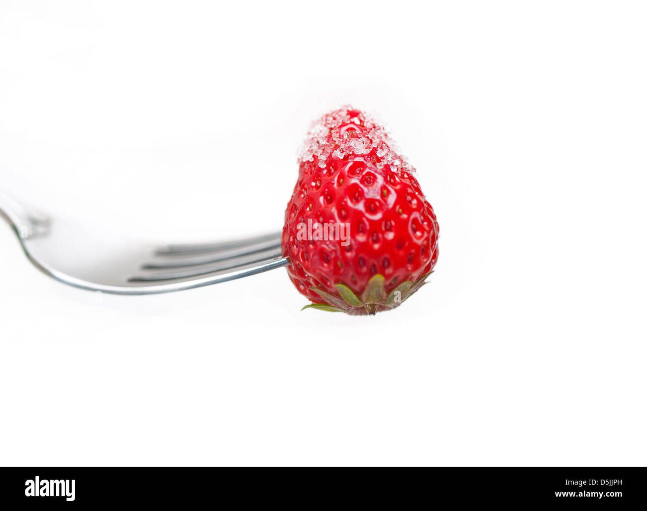 srawberry on a fork with sugar crust isolated over white Stock Photo ...