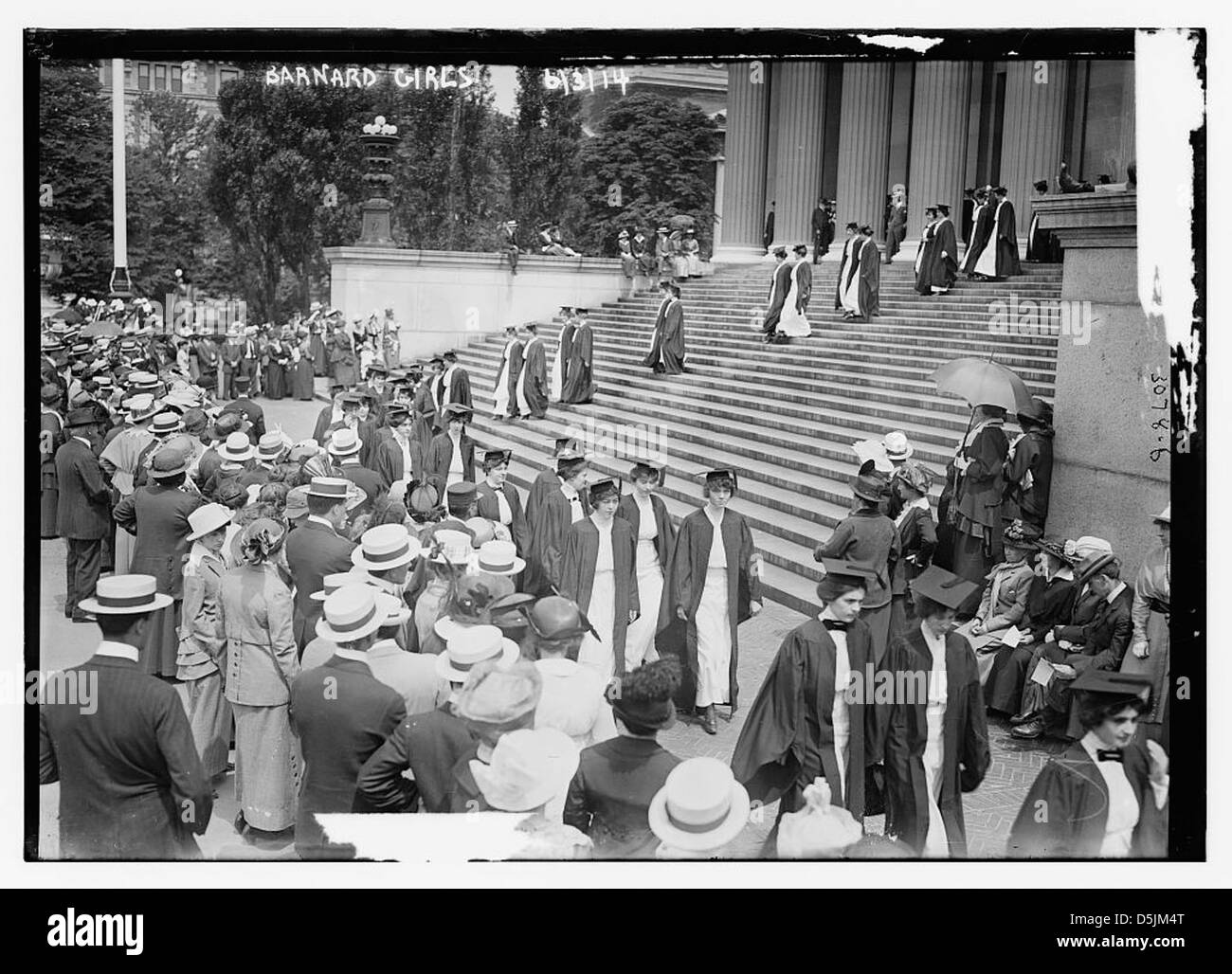 Barnard College students, wearing gowns and mortarboards, march in ...