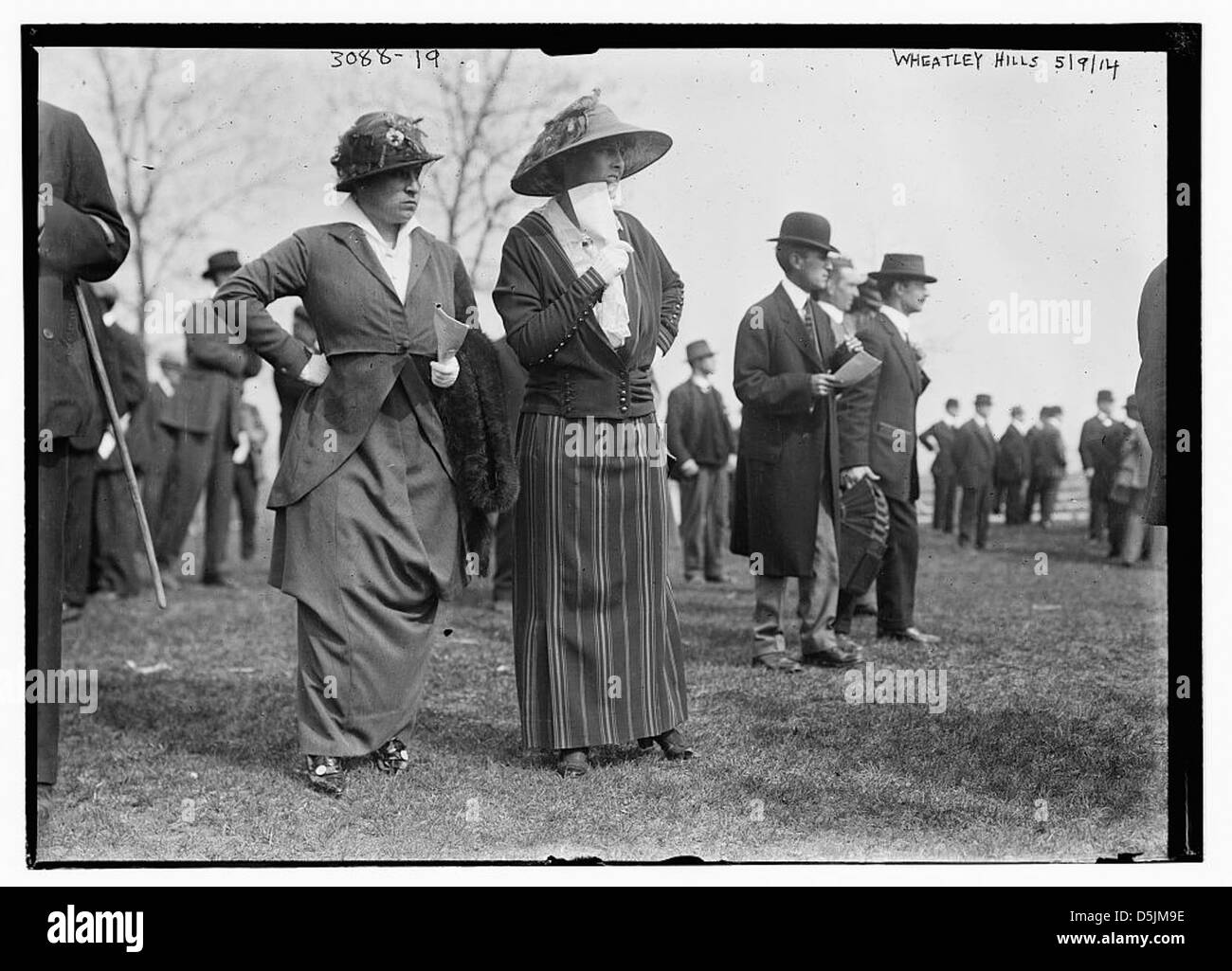 Two women stand outdoors at Wheatley Hills, Long Island, in 1914 ...