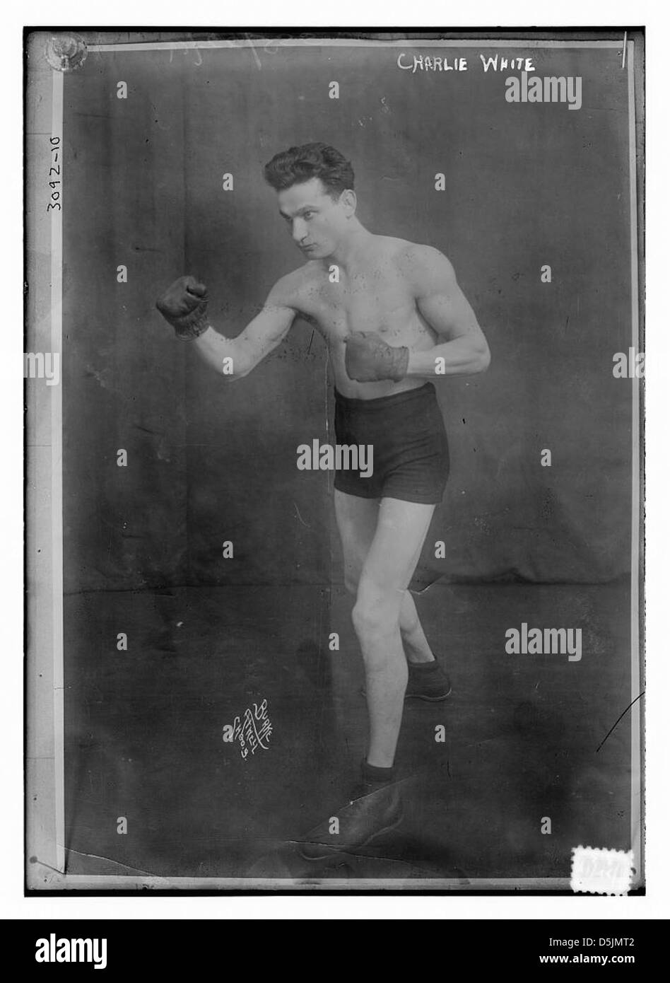 This vintage photograph captures Charlie White, an American boxer known ...