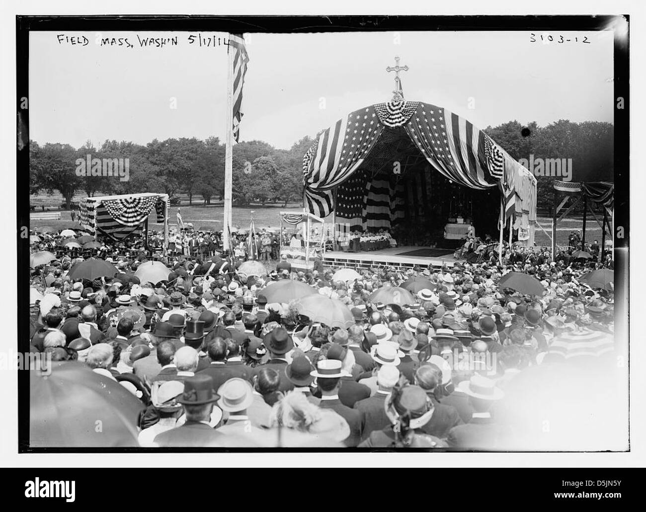 A photograph from May 17, 1914, showing a large crowd attending a mass ...