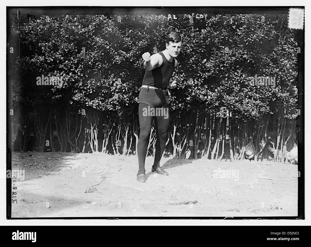 Al McCoy, a professional boxer, is captured in a posed photograph ...