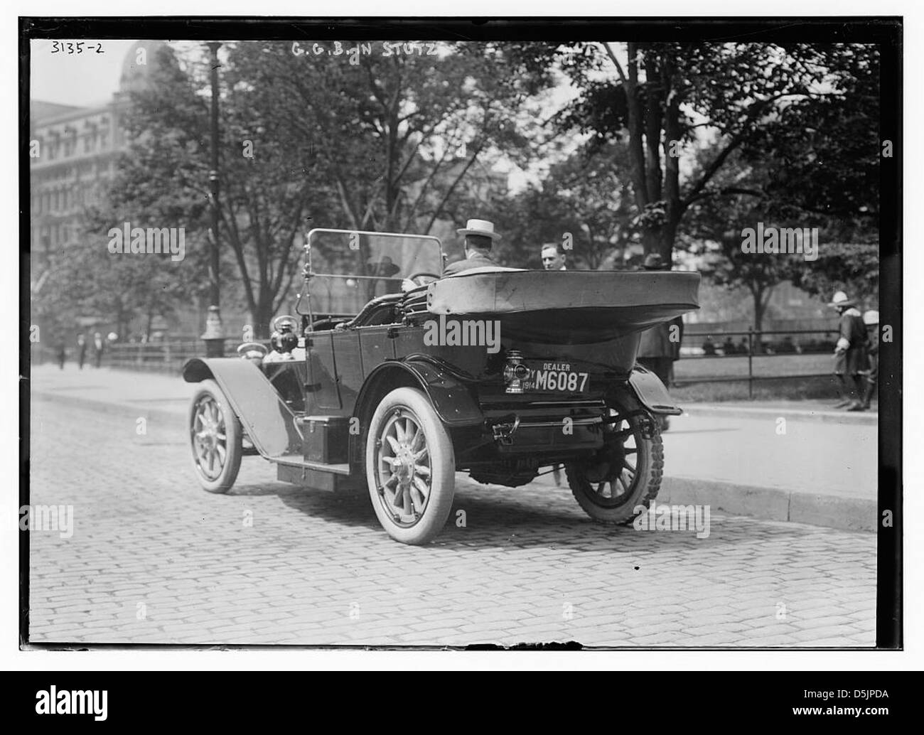 George Grantham Bain is seen driving a Stutz automobile, photographed ...