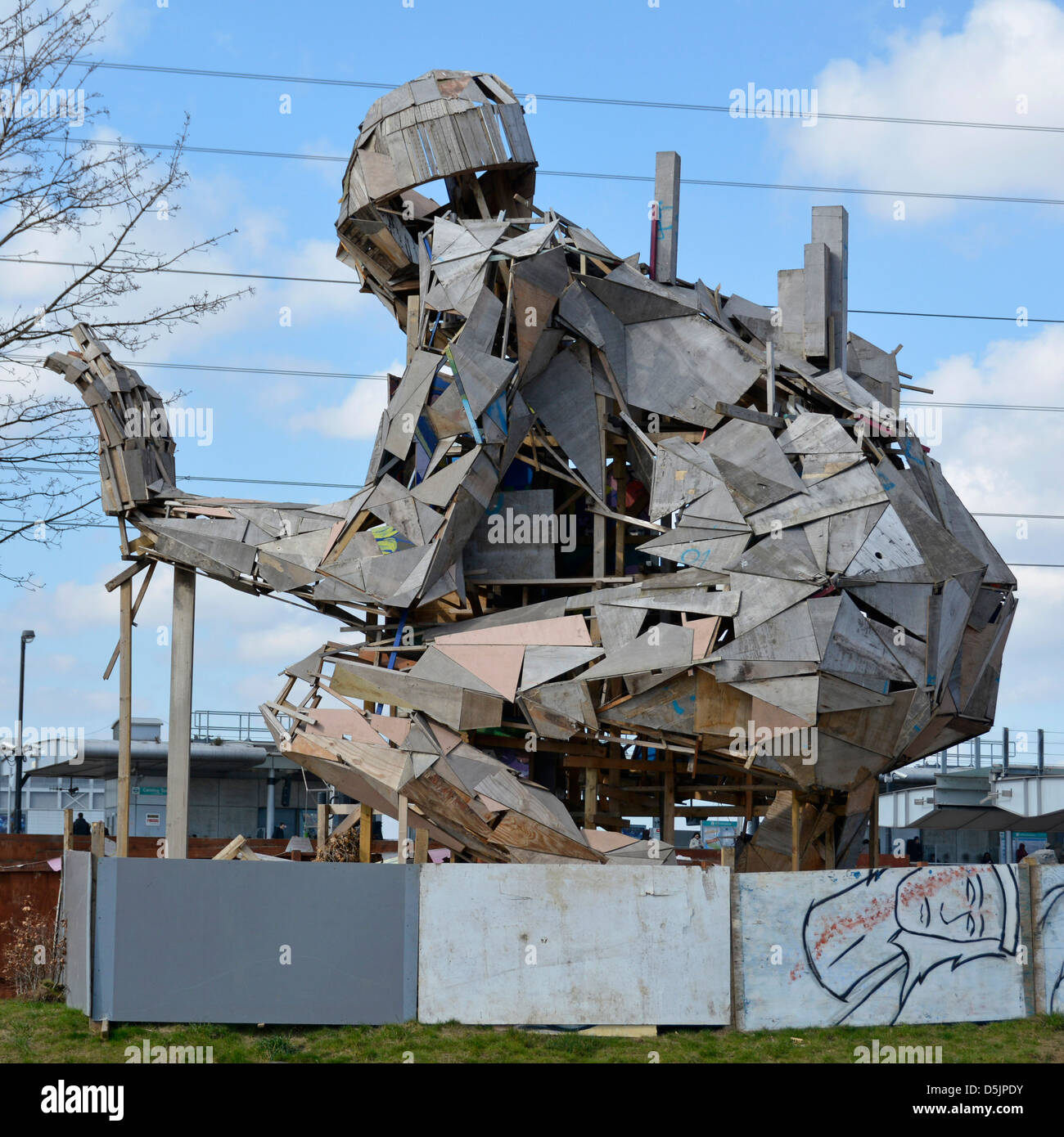 Hoarding around industrious Art Installation built from scrap timber ...