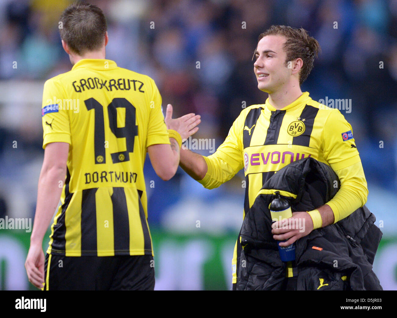 Dortmund's Kevin Grosskreutz and Mario Goetze (R) shake hands after the ...