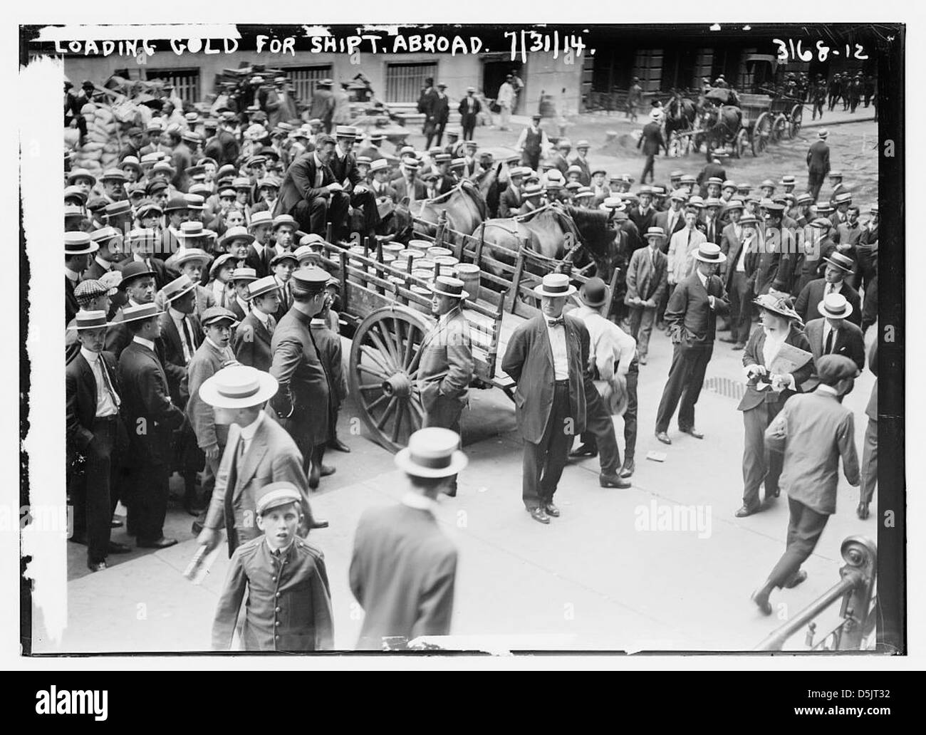 A 1914 photograph depicting the loading of gold for international ...