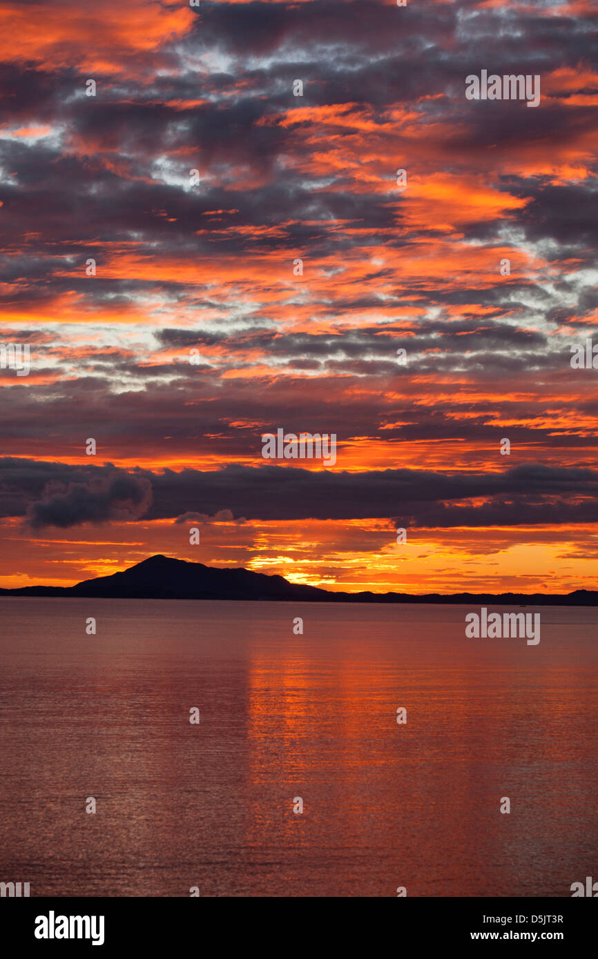 Madagascar, Ankify, sun rising over north Madagascan coast Stock Photo ...